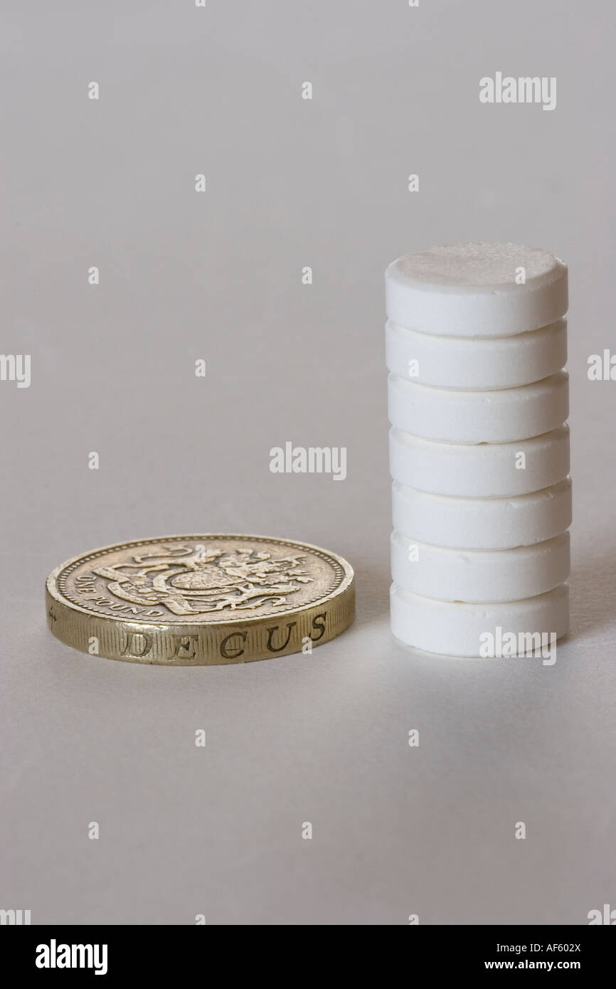 Coins and pills Stock Photo - Alamy