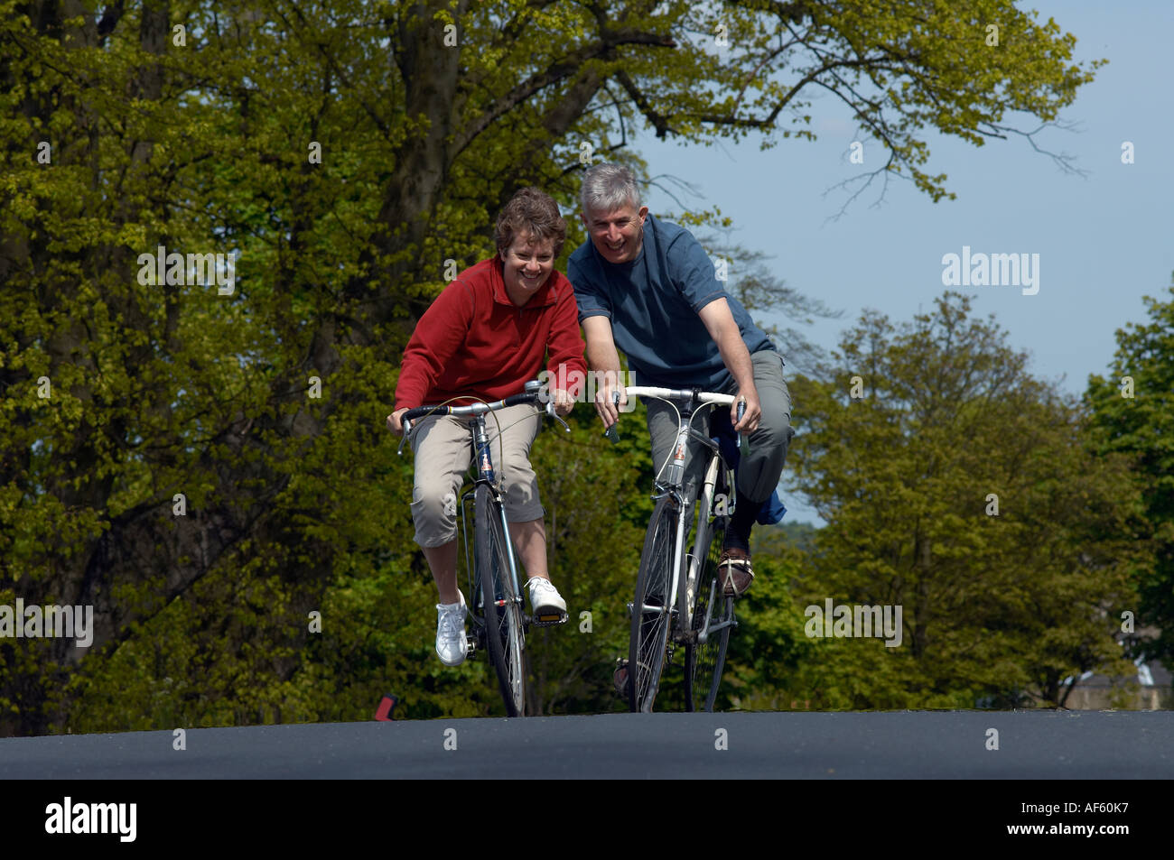 older ride their bicycles and enjoy the landscape with their bicycle in ...