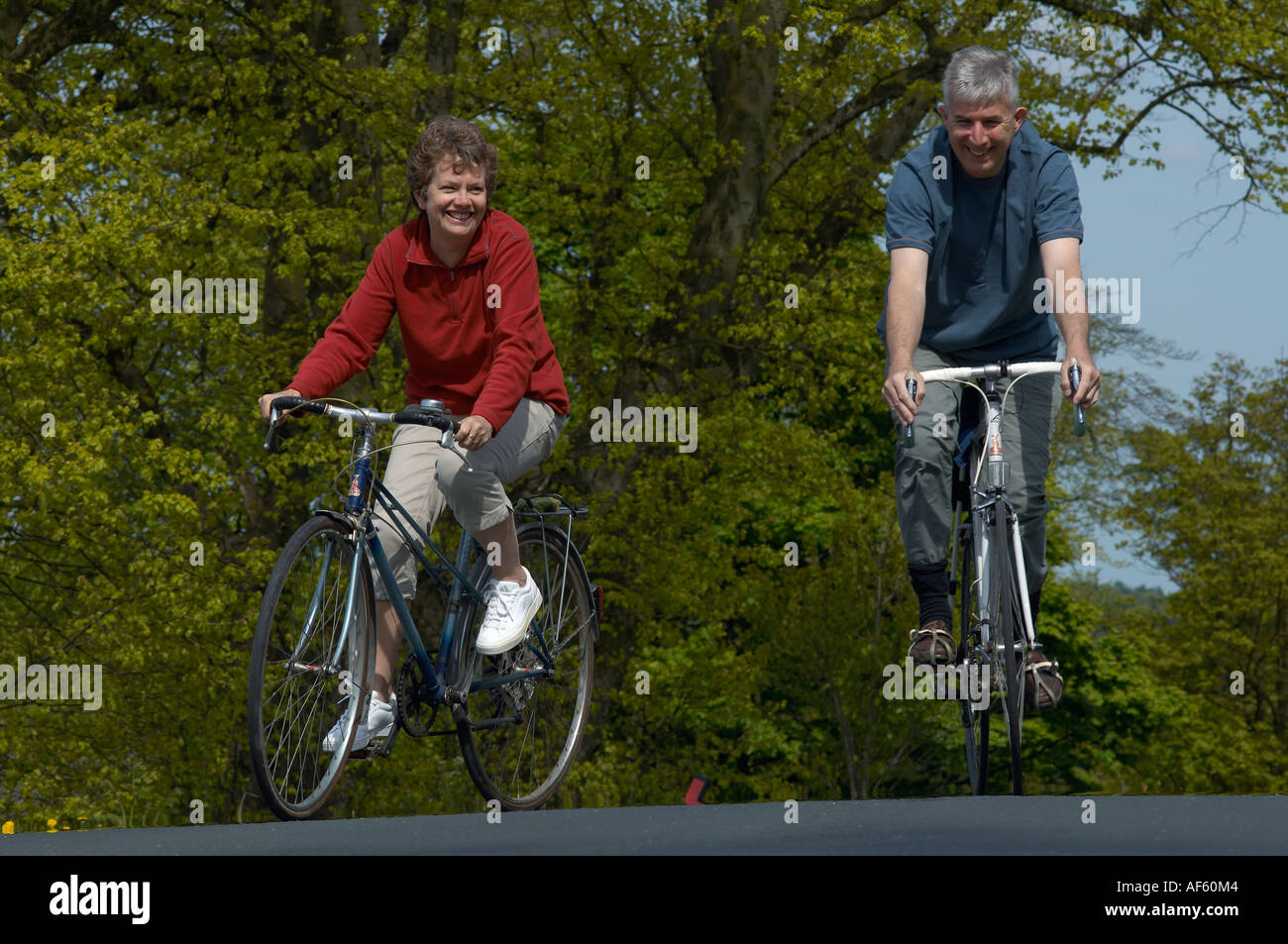 older ride their bicycles and enjoy the landscape with their bicycle in ...