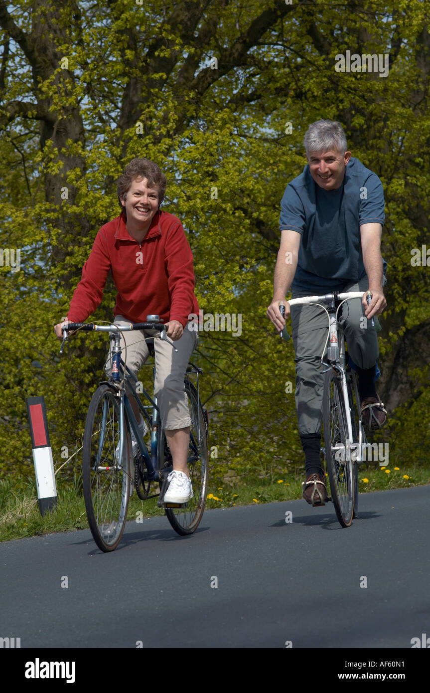 older ride their bicycles and enjoy the landscape with their bicycle in ...