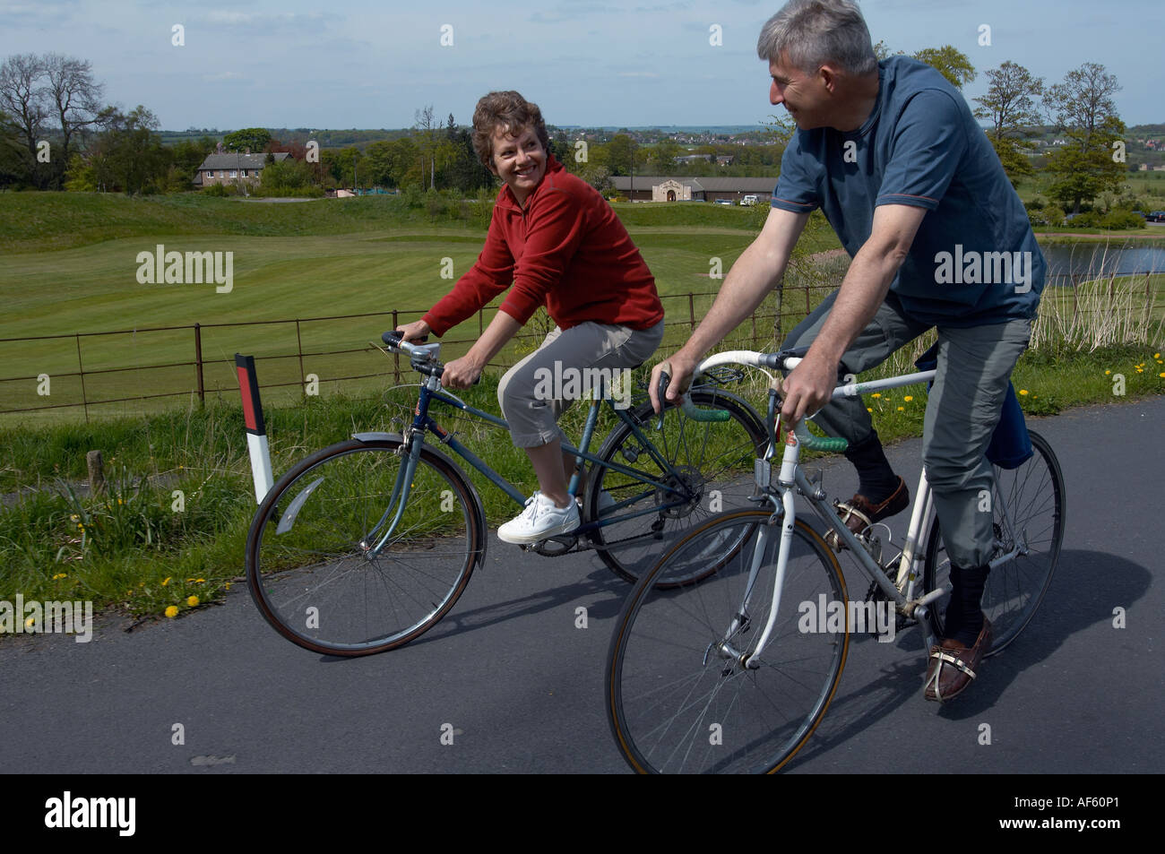 older ride their bicycles and enjoy the landscape with their bicycle in ...