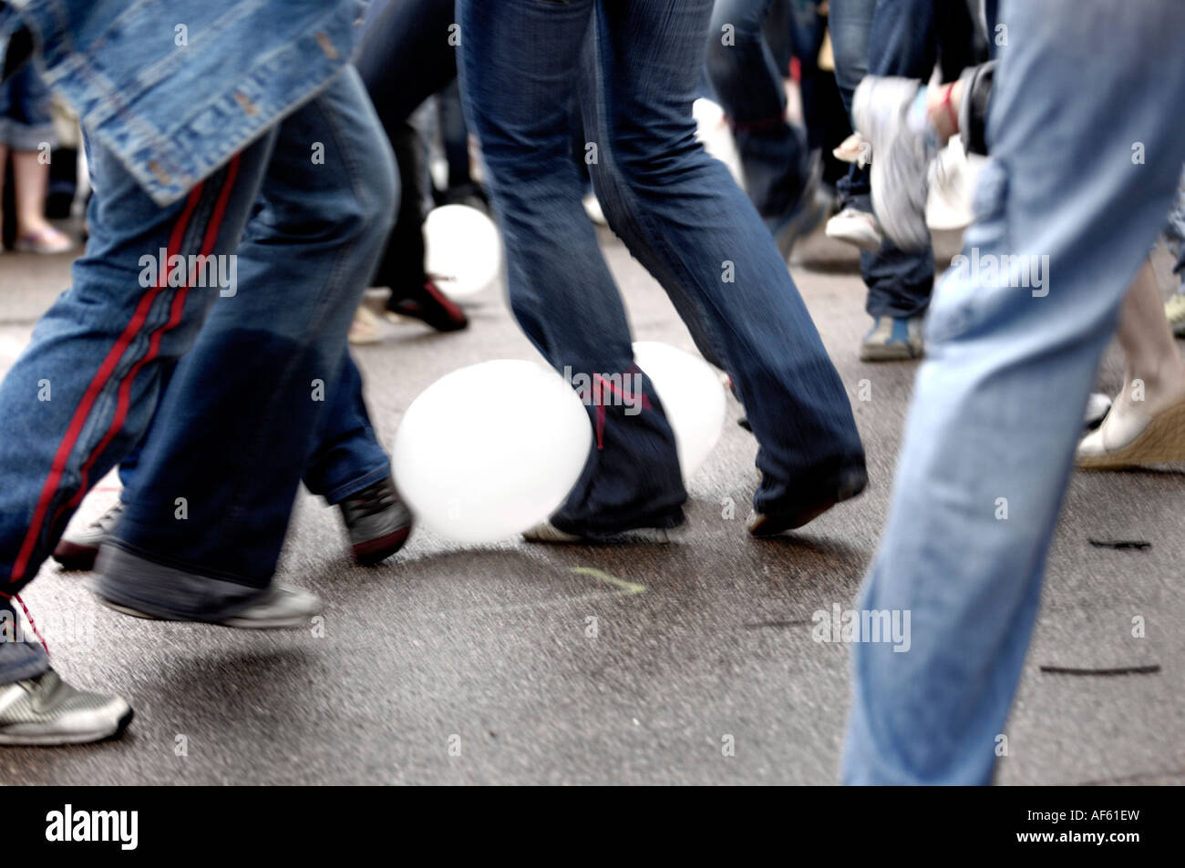 Legs of people playing funny outdoor game Stepping on balloons Fun ...
