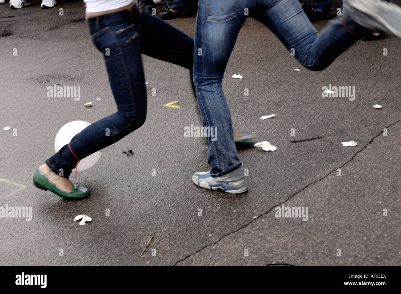 Legs of people playing funny outdoor game Stock Photo - Alamy