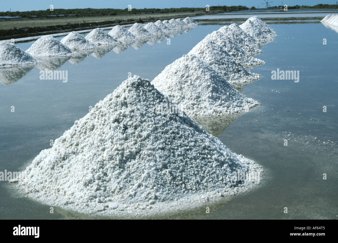 Piles of salt gathered up in a salt lagoon Samut Songkhram Thailand ...