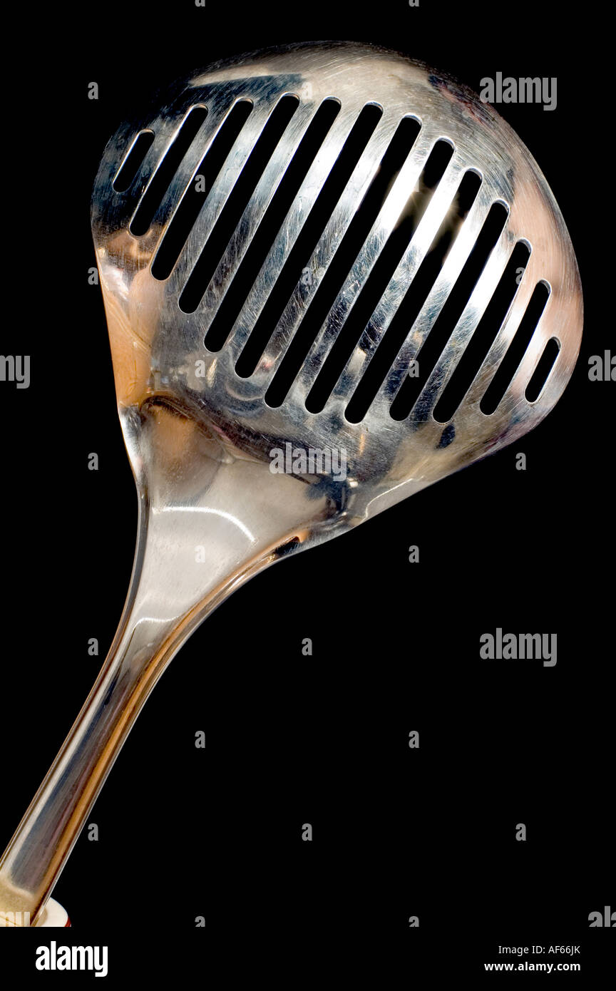 series object on black kitchen utensil colander Stock Photo - Alamy