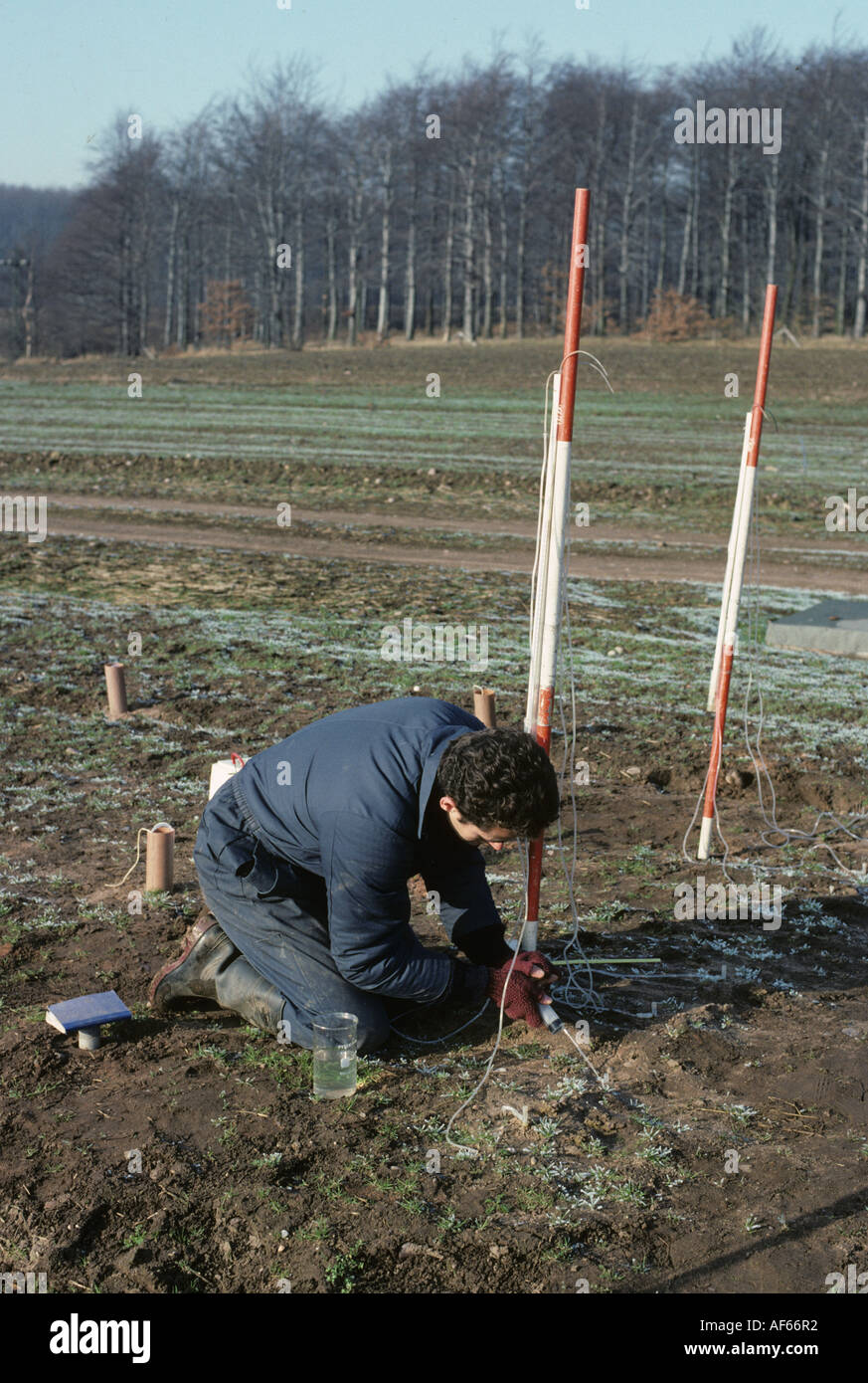 Scientist measuring the pressure of underground water with a series of ...