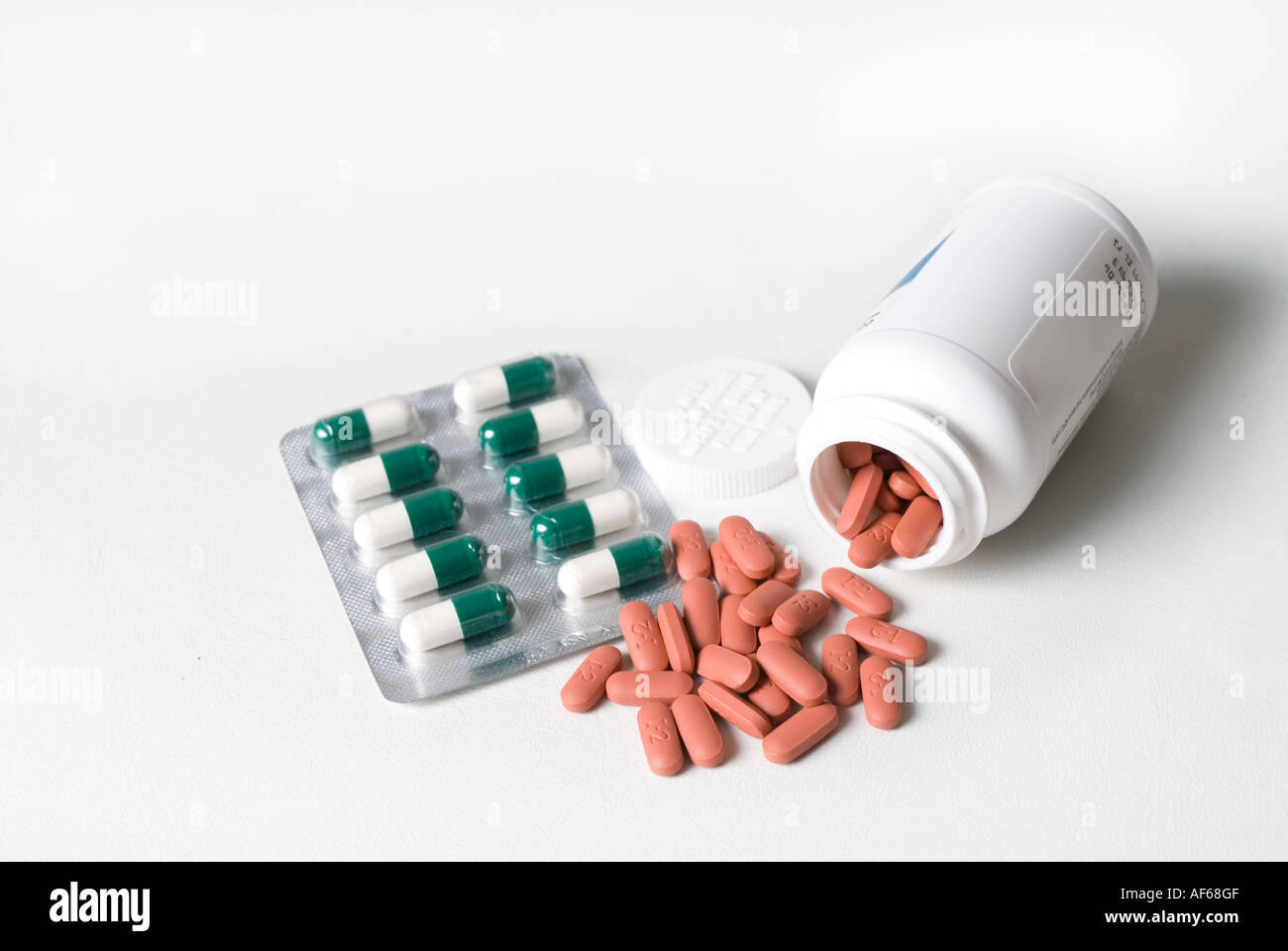 spilled pile of red tablets Stock Photo - Alamy