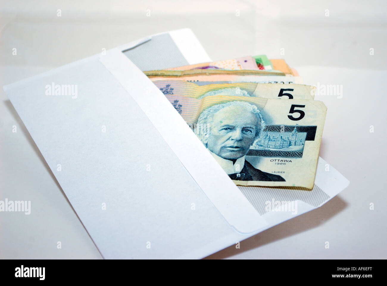 Currency in an envelope Stock Photo - Alamy