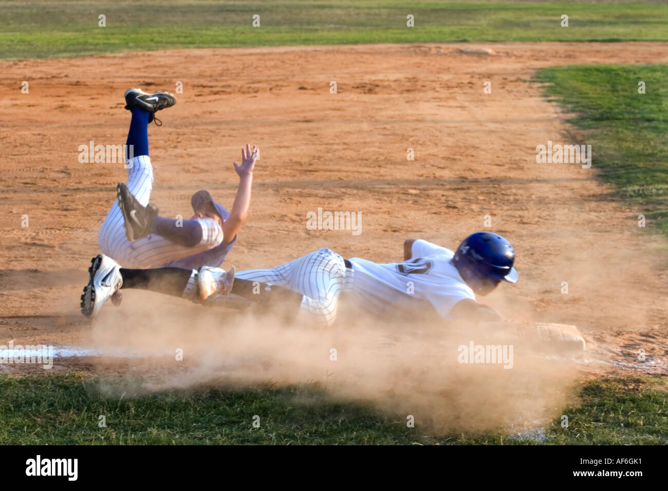 Baseball collision at 3rd base Stock Photo - Alamy