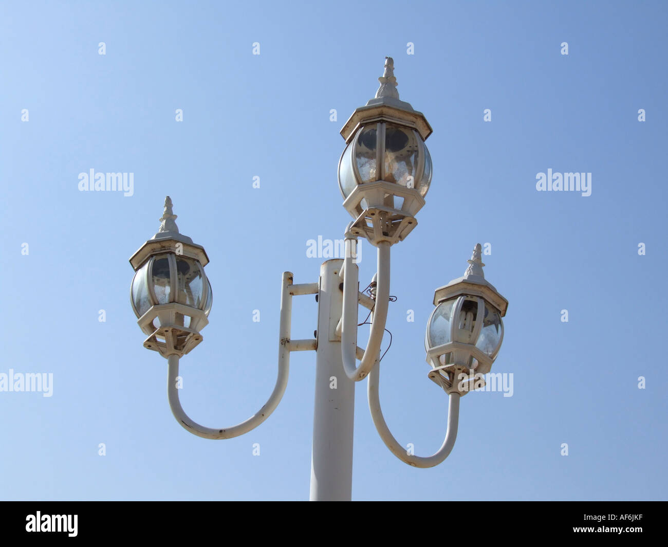 Outside lamp post with three lamps Stock Photo - Alamy