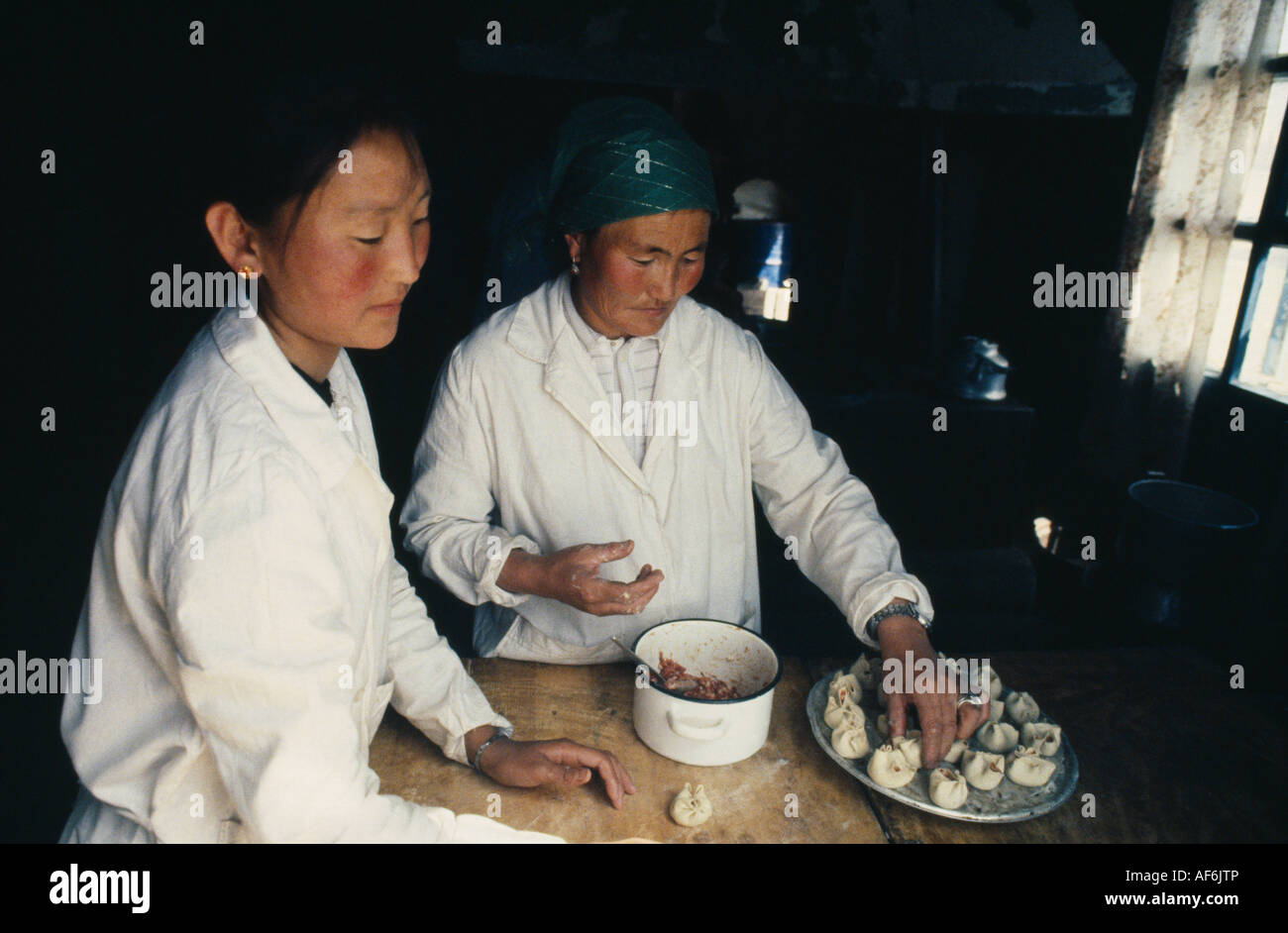 MONGOLIA People Food Two women making Buuz steamed minced lamb ...