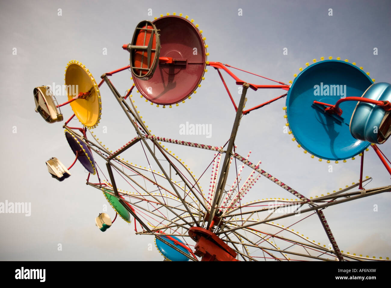 A colourful empty fairground ride in action at Hunstanton Norfolk UK ...