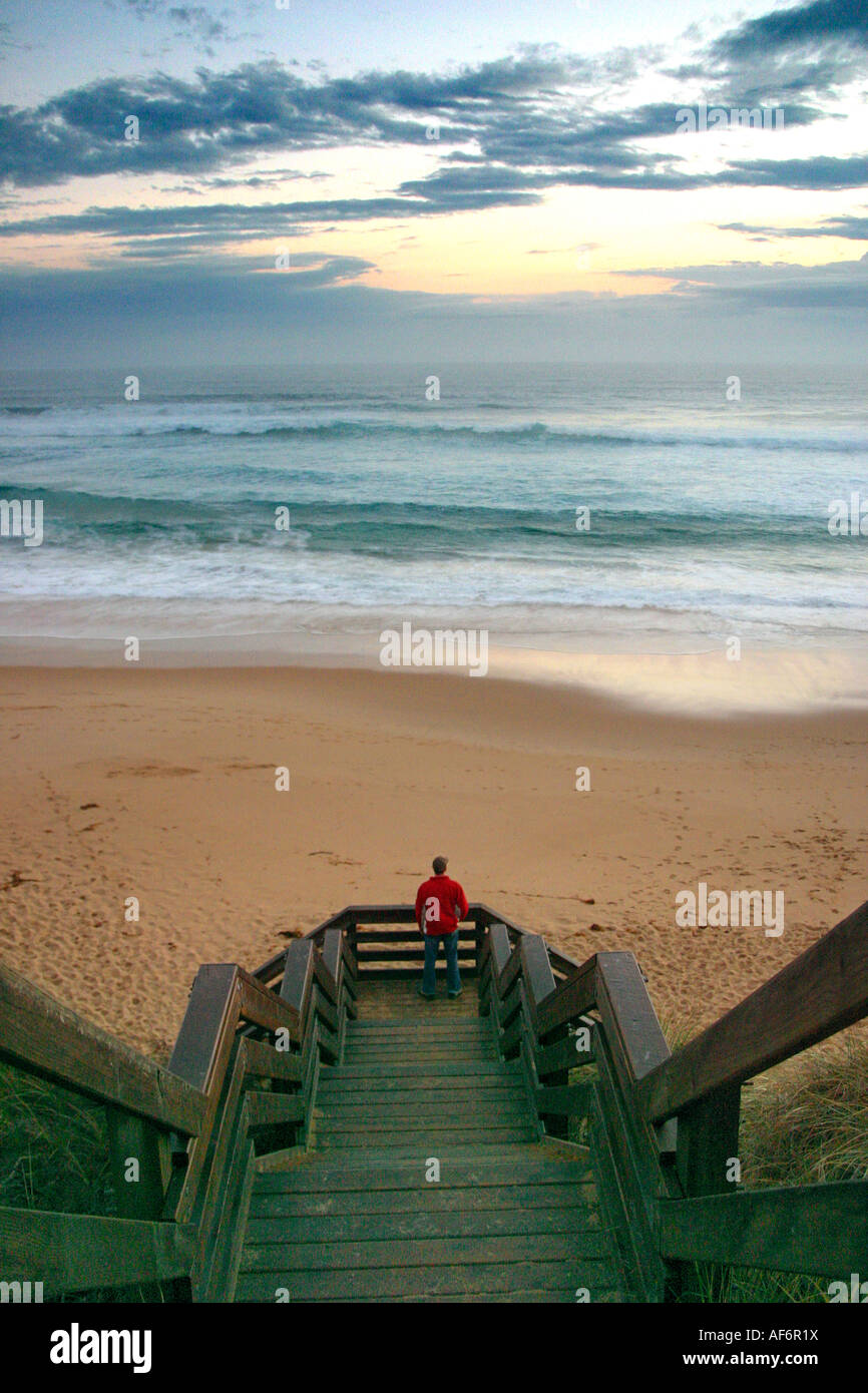 Man looking out to sea Stock Photo - Alamy