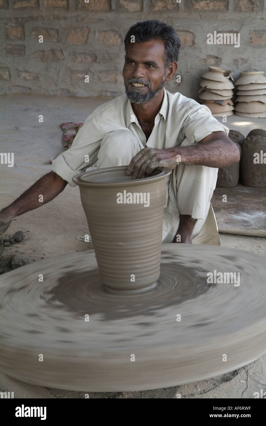 Man making clay pots in a Bishnoi village outside of Jodhpur in India ...