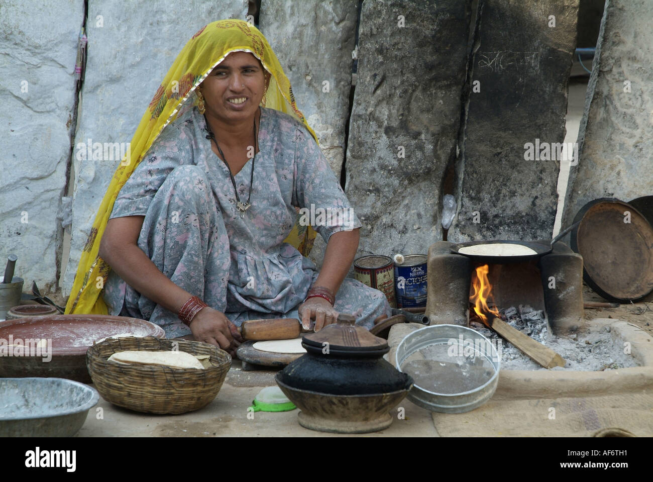 Bishnoi woman making chapattis in India Stock Photo - Alamy