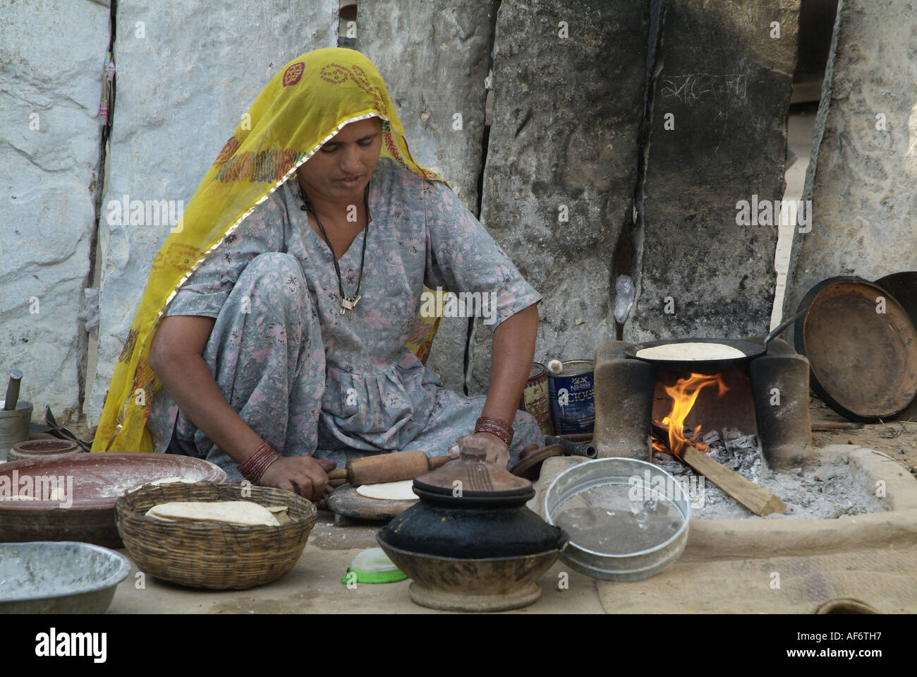 Bishnoi woman making chapattis in India Stock Photo - Alamy