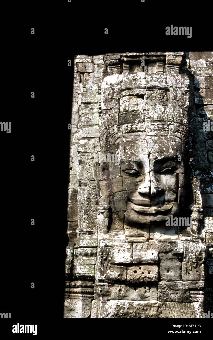 Smiling face statue at Bayon Temple- Angkor Wat ruins, Cambodia Stock ...