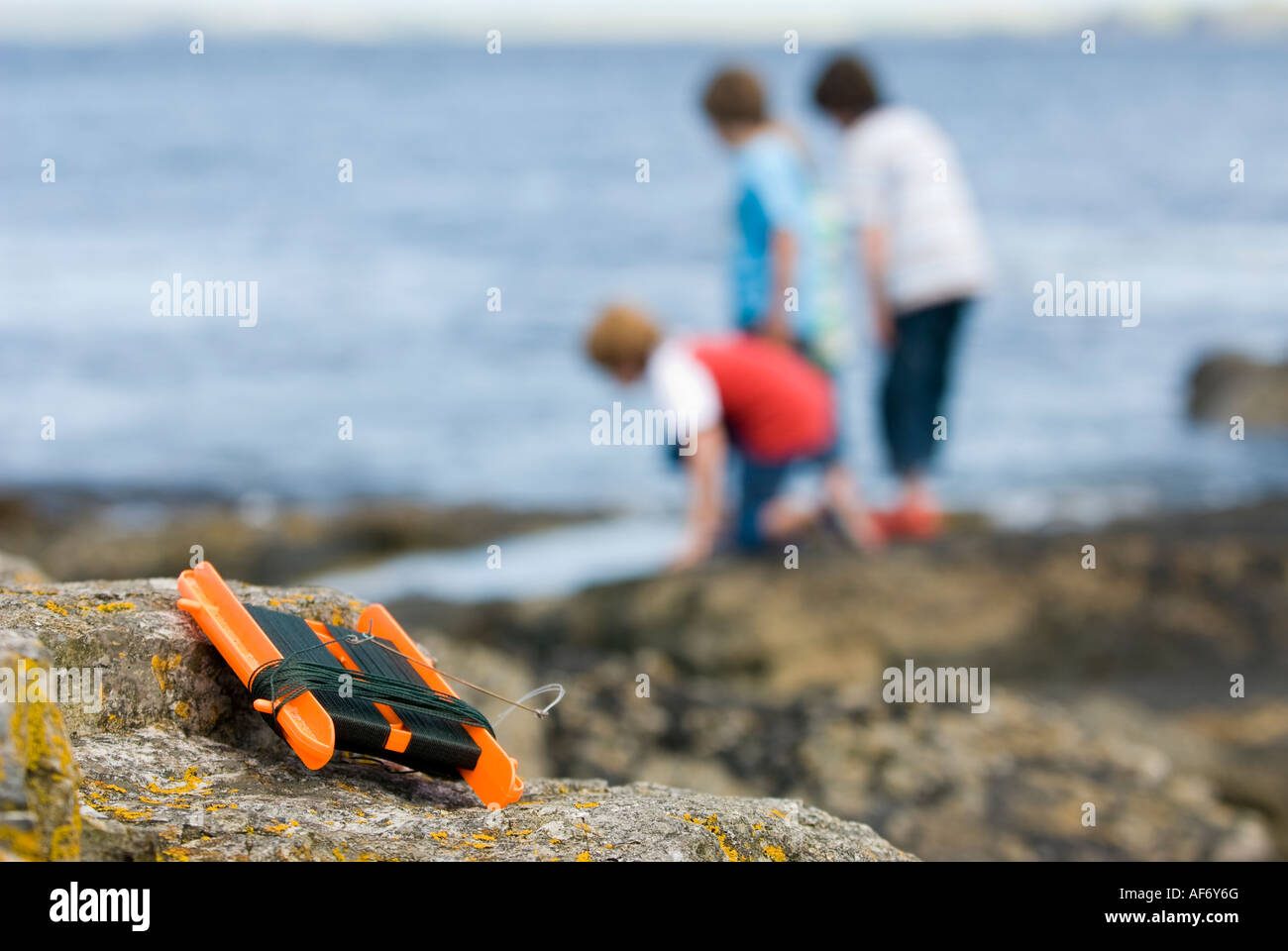 Crab line with boys in the background Stock Photo - Alamy