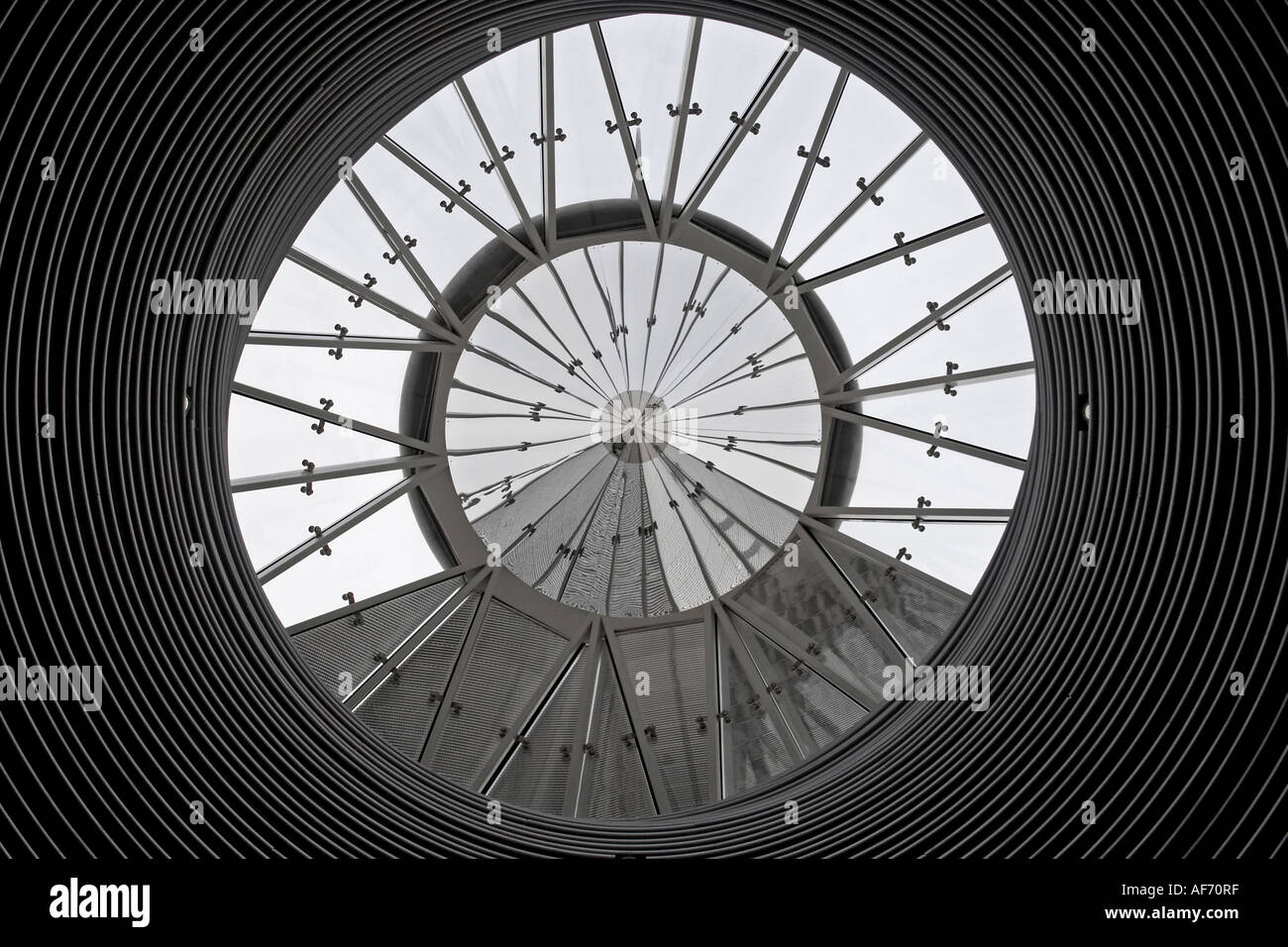 View up inside funnel with inverted cone light reflecting mirrors above ...