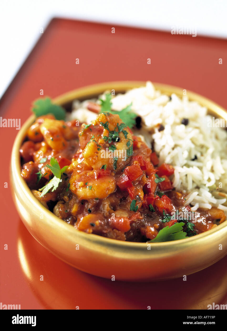 A bowl of prawn curry and rice Stock Photo - Alamy