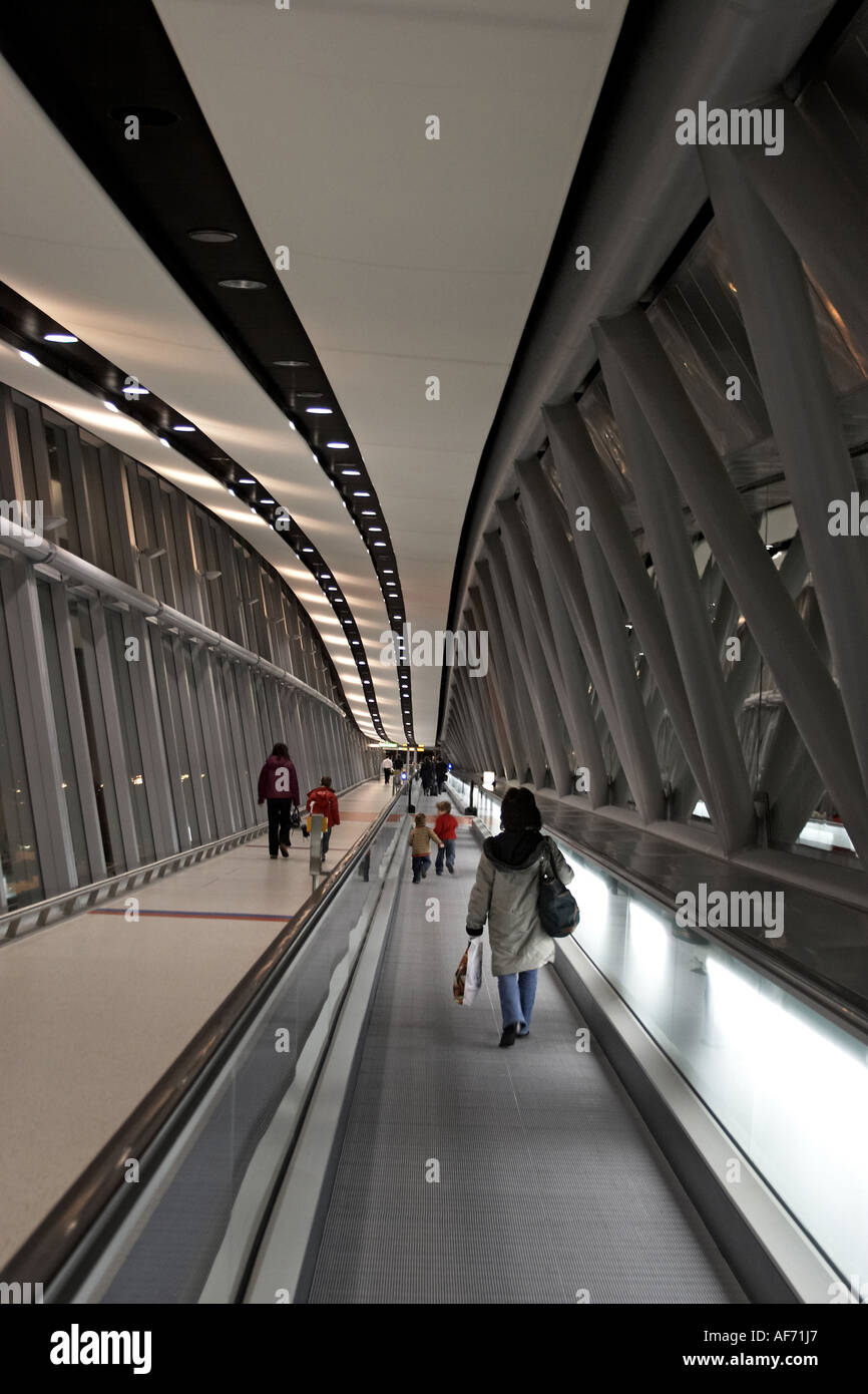 People woman and children on bridge moving walkway travellator at ...