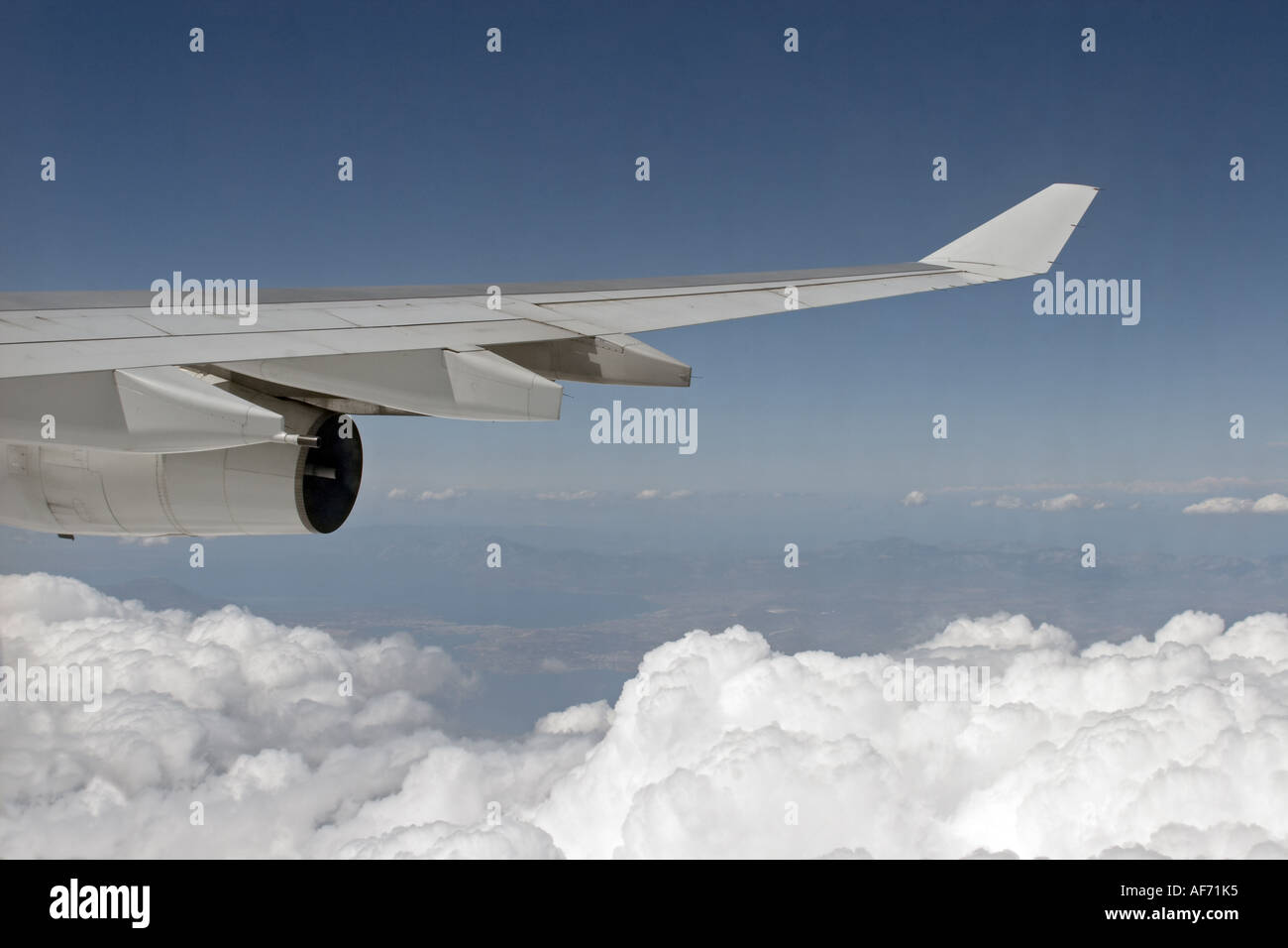 Aerial view of Airbus A300 aircraft wing over clouds above Evia Greece ...