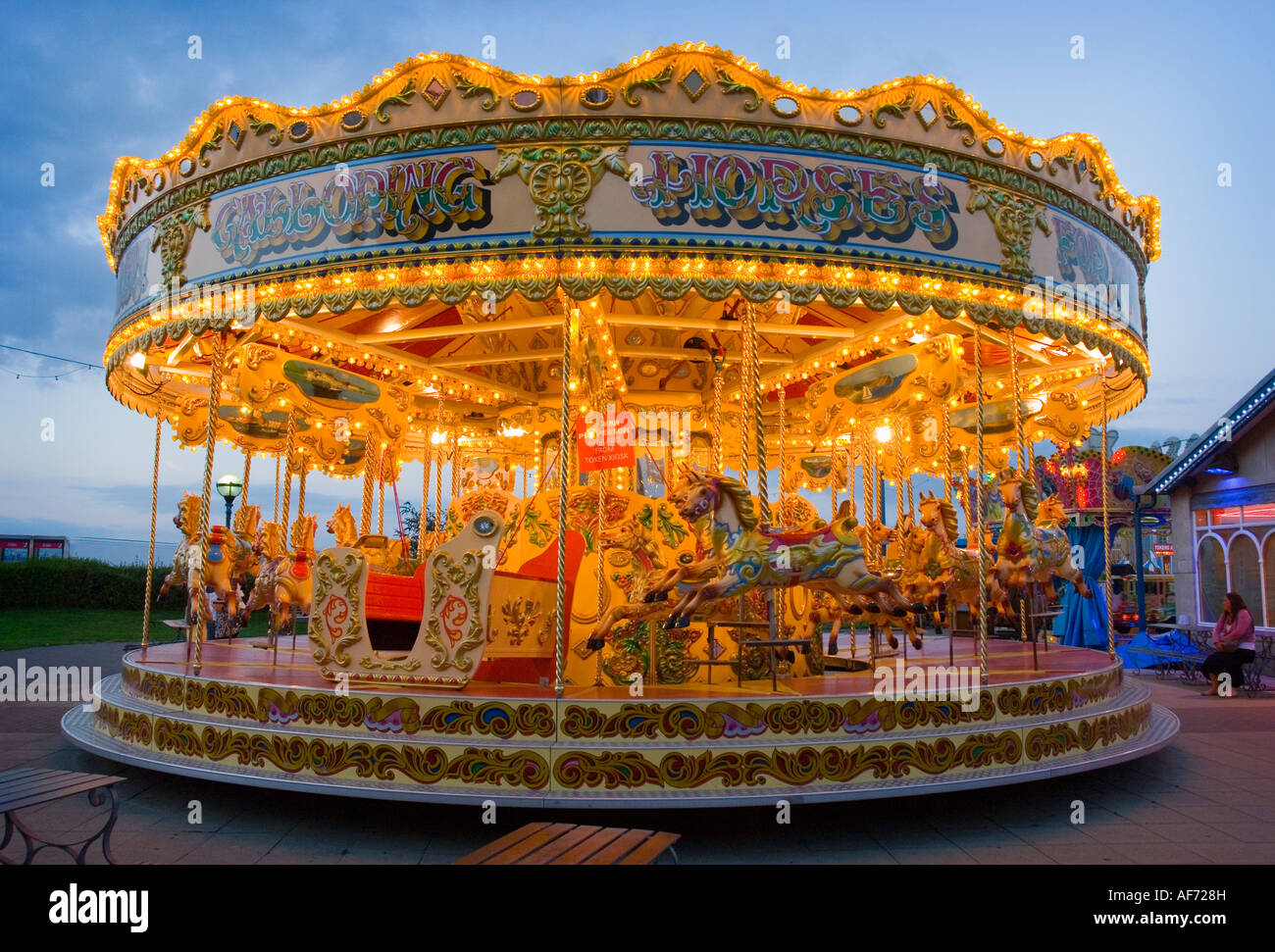 Fairground carousel ride at dusk Weymouth Dorset Stock Photo - Alamy