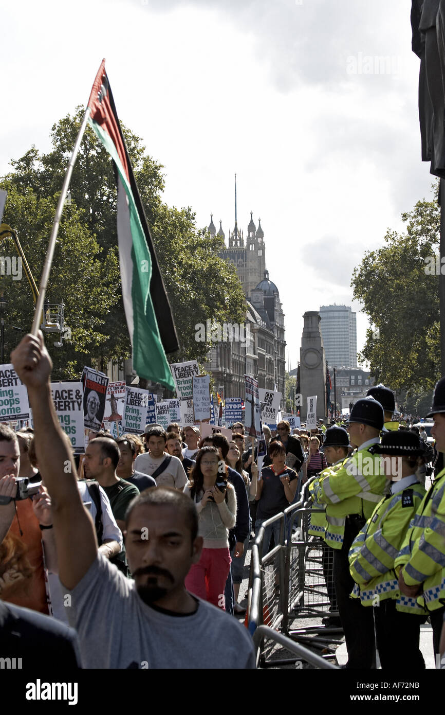 Police officers and People with posters signs and banners on anti Iraq ...