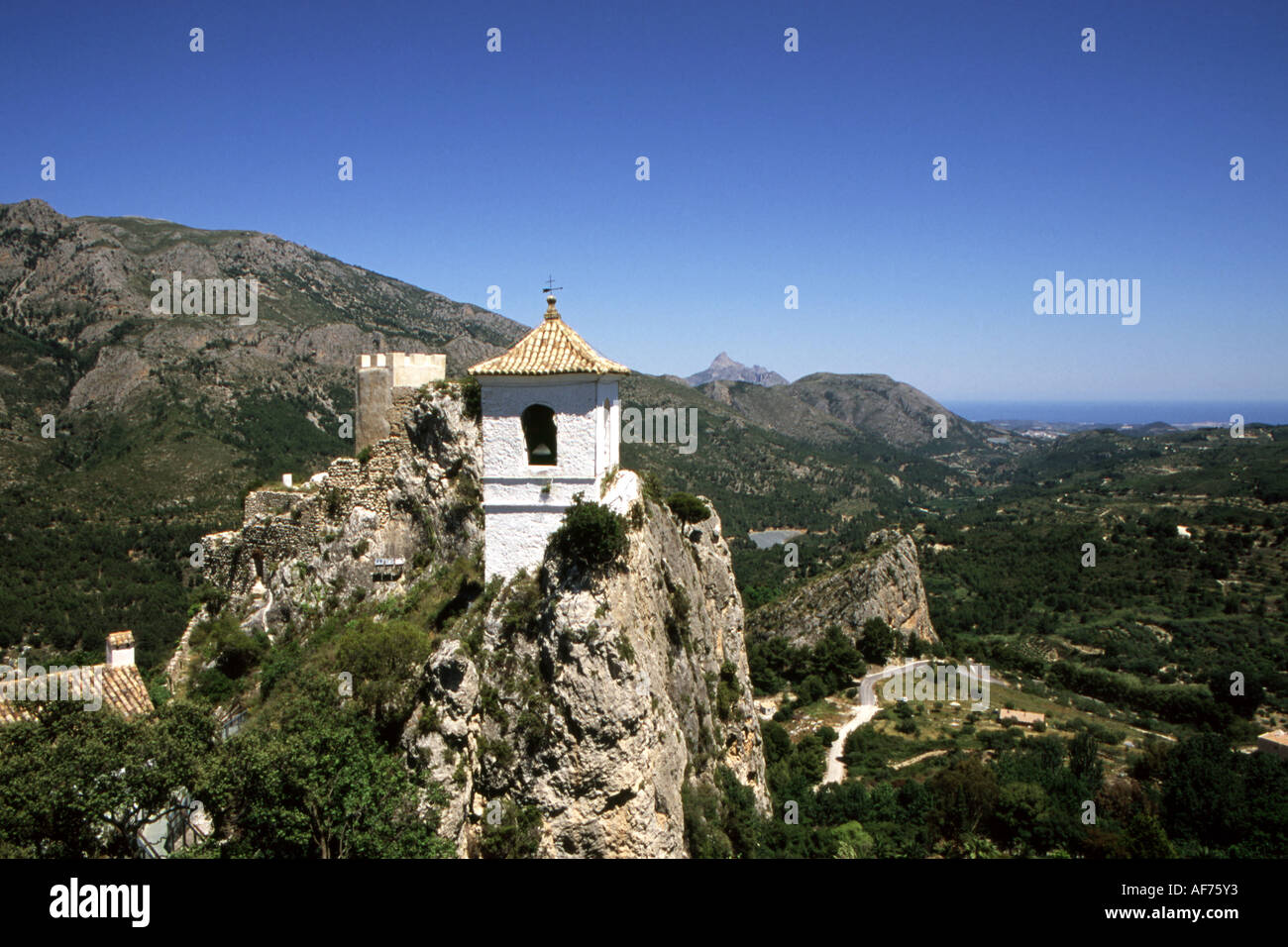 Guadalest Castle with view down valley towards Benidorm Guadalest Spain ...