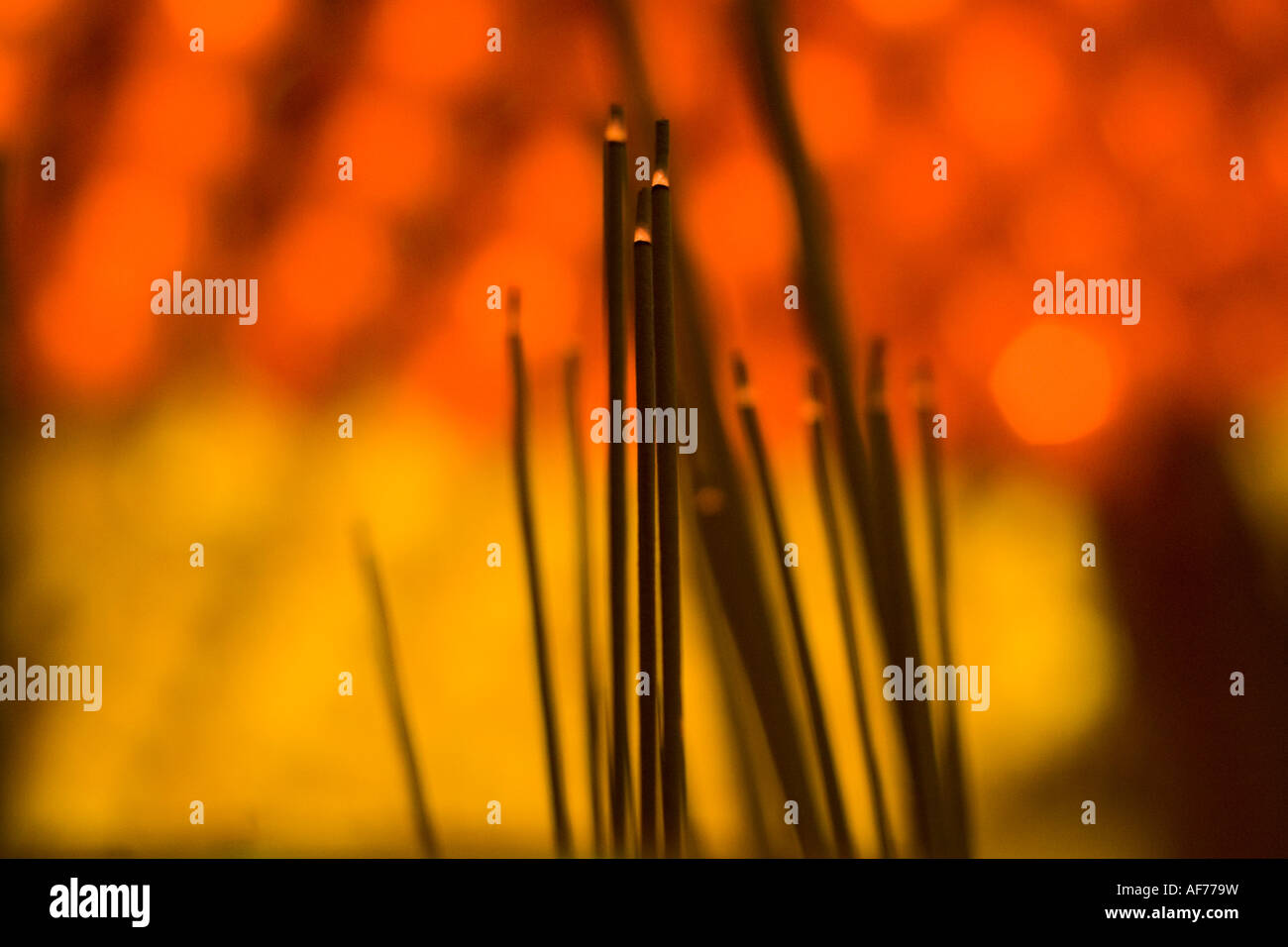 Joss stick in temple with lanterns in background Stock Photo - Alamy