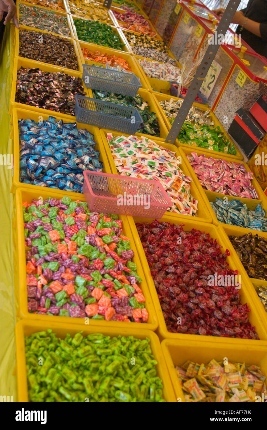 trays of colourful sweets and candies being sold at a bazaar stall in ...