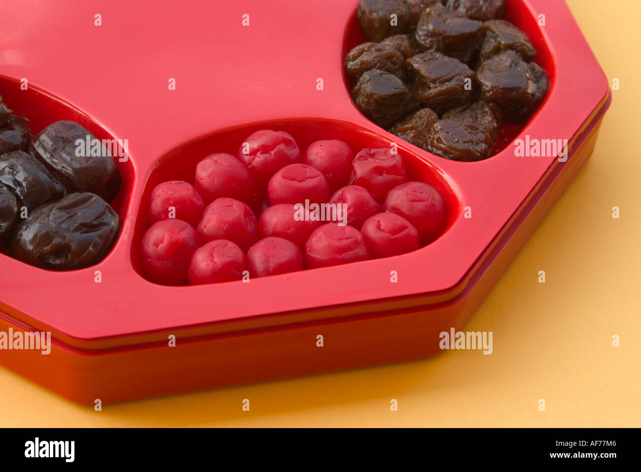 close up of a tray of preserved fruit sweets served during chinese new ...