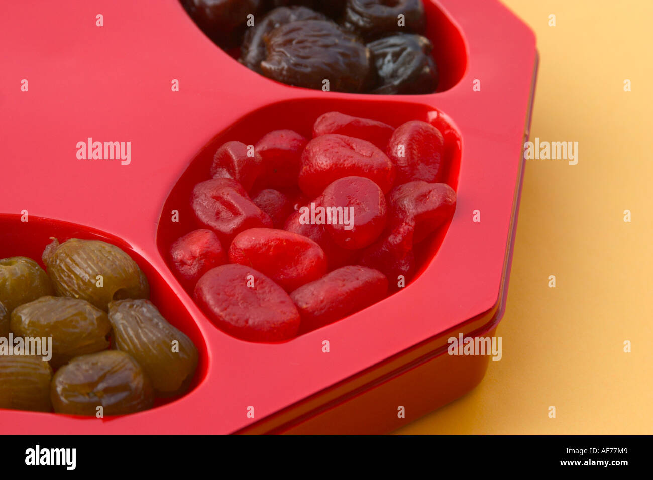 close up of a tray of preserved fruit sweets served during chinese new ...