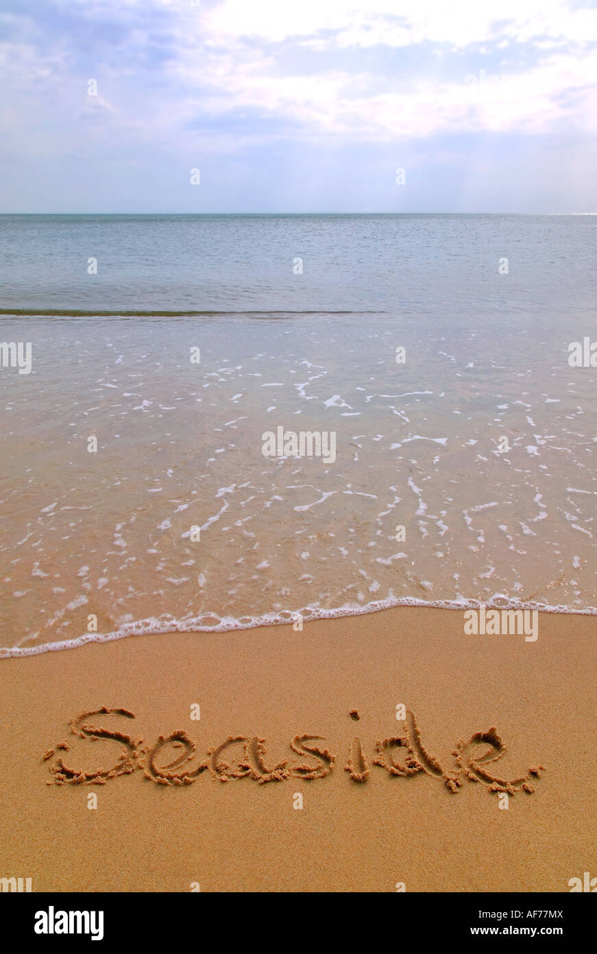 Seaside written in sand on a beach Stock Photo - Alamy