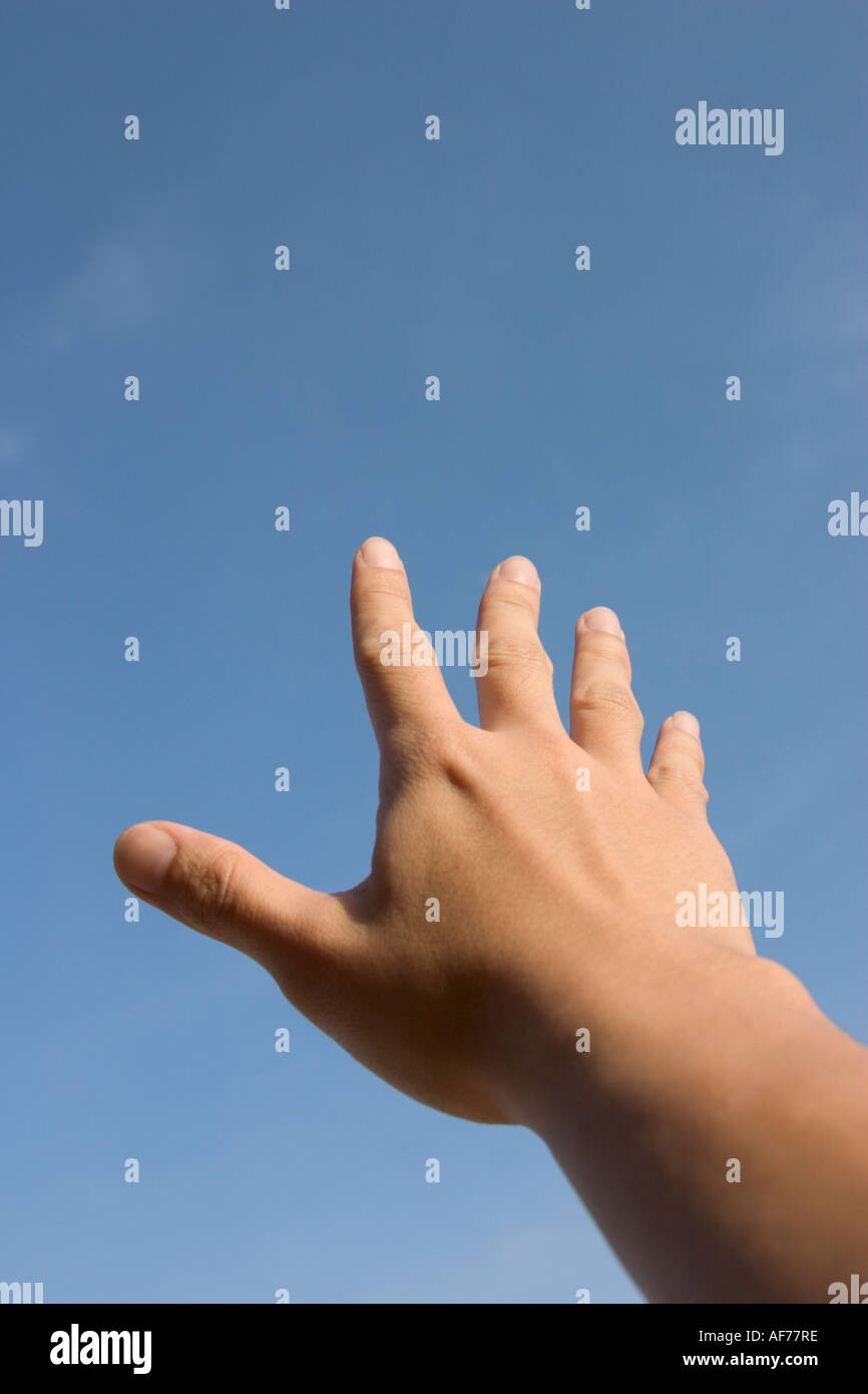 hand reaching for the skies concept reaching out sky is the limit ...