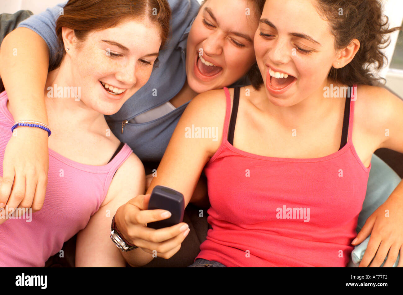 Teenage Girls texting Stock Photo - Alamy