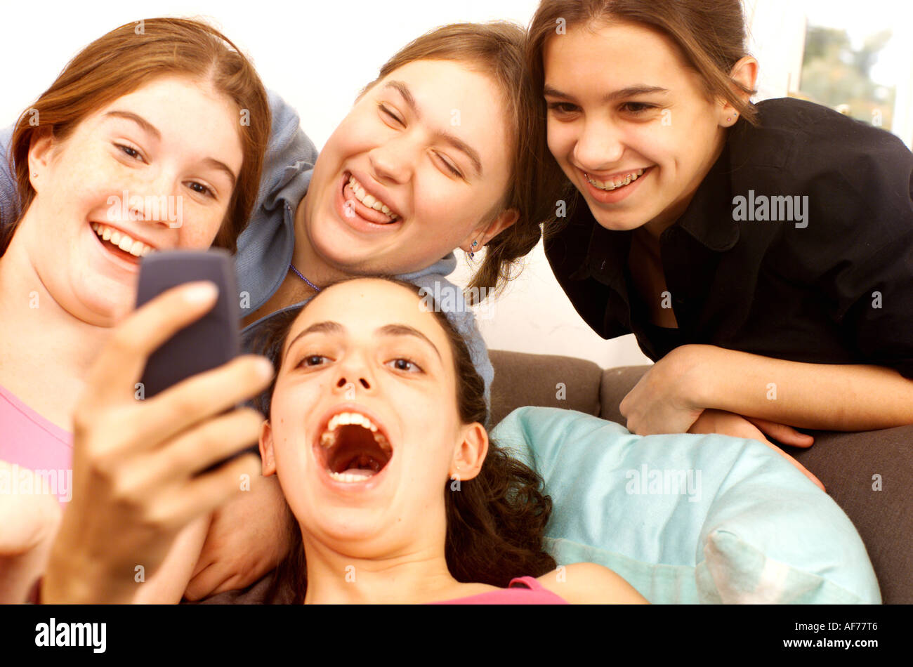 teenage girls texting Stock Photo - Alamy