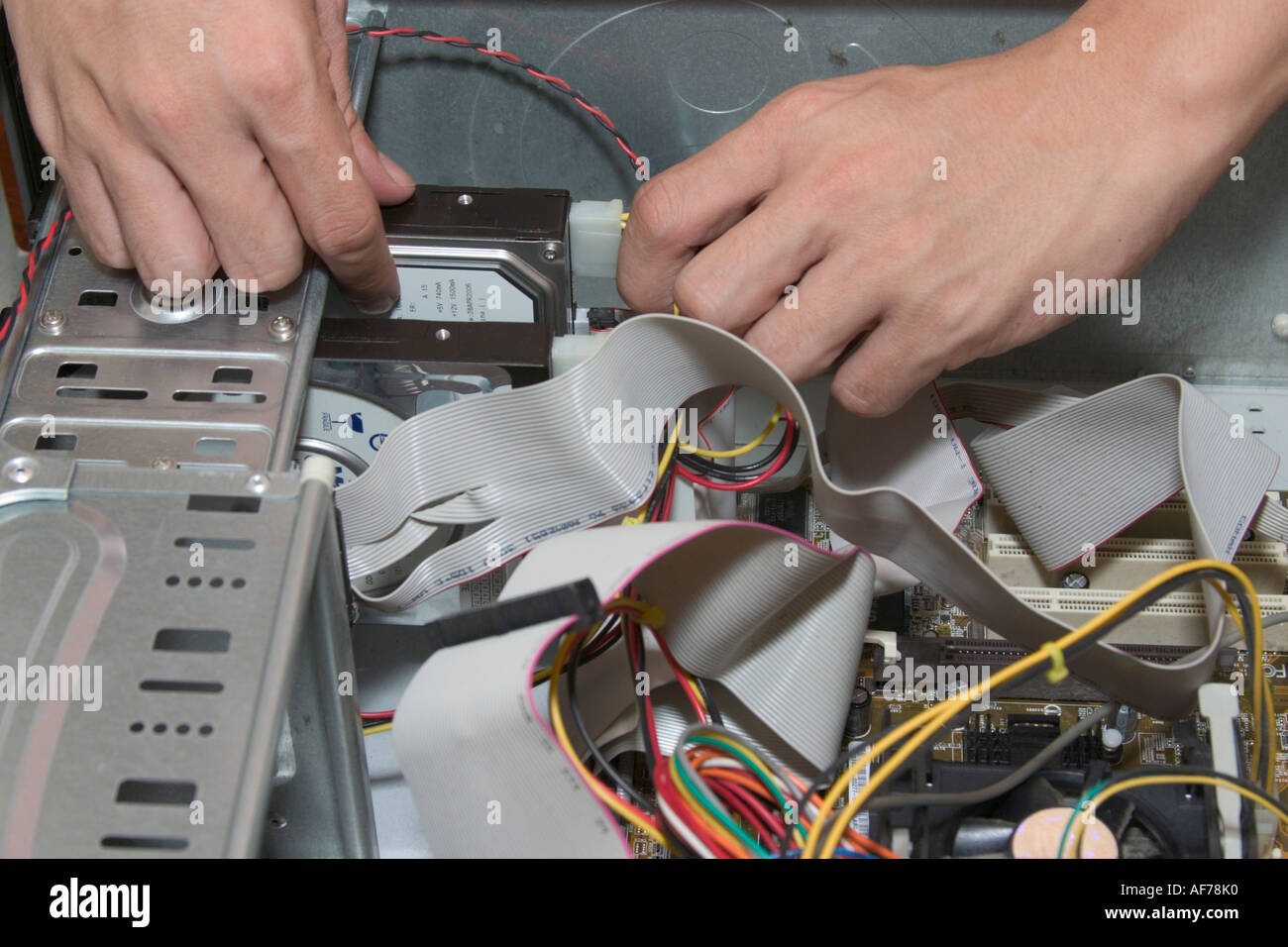 hand assembling cable of a personal computer Stock Photo - Alamy