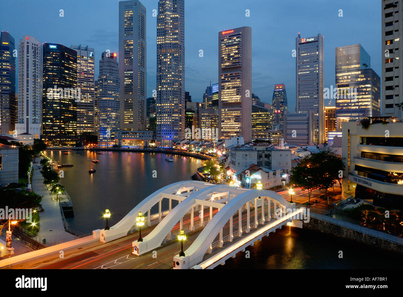 The Singapore River flows under Elgin Bridge past Boat Quay and the CBD ...