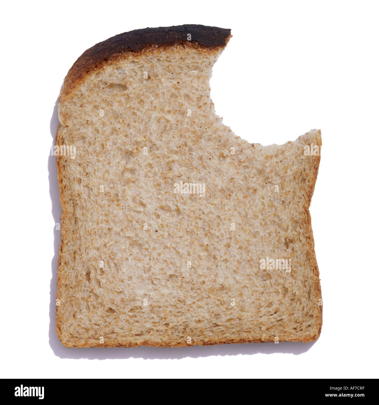 A bitten slice of wholemeal bread Stock Photo - Alamy