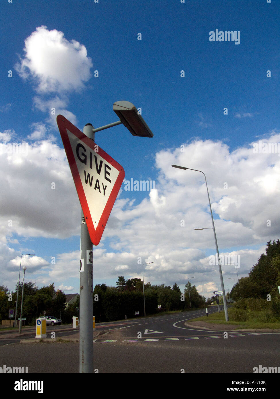 Give way sign dramatic view Stock Photo - Alamy