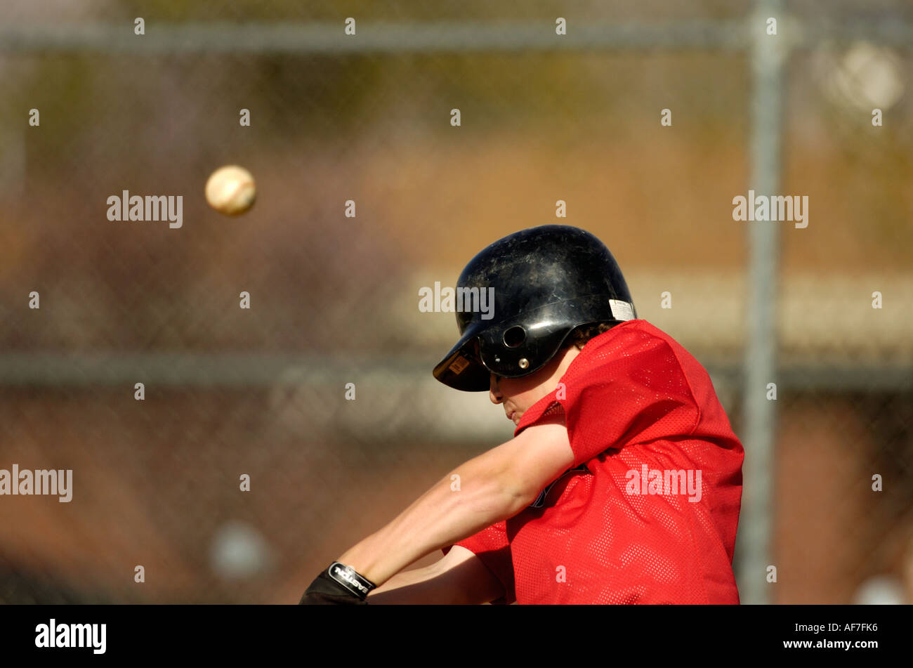 Baseball player fouling off ball viewed from behind Stock Photo - Alamy