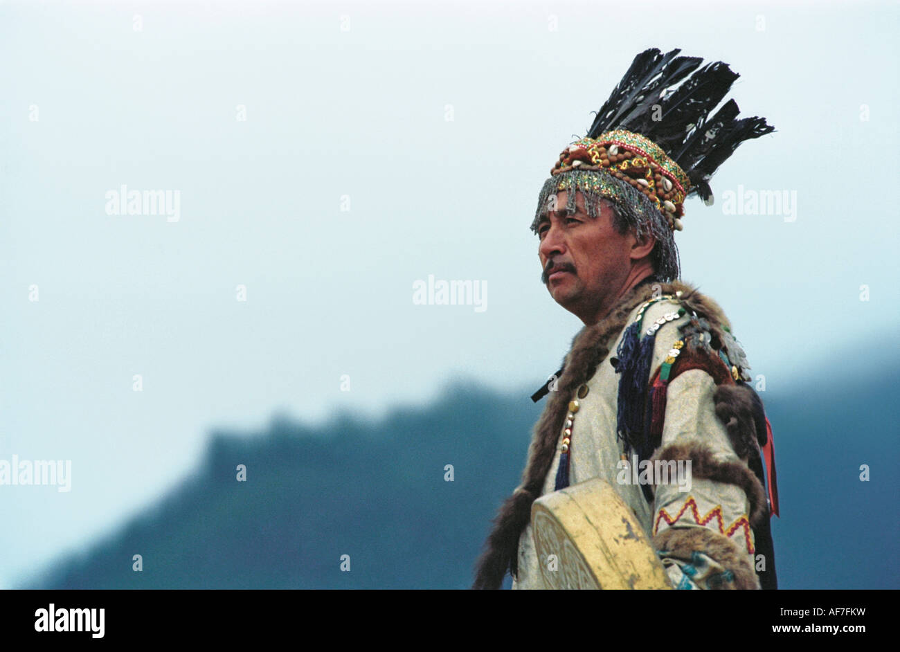 Shaman is performing ritual ceremony (kamlanie). El-Oiyn national ...