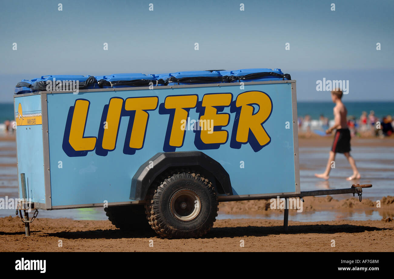 A litter trailer on the beach in Woolacombe, North Devon UK Stock Photo ...