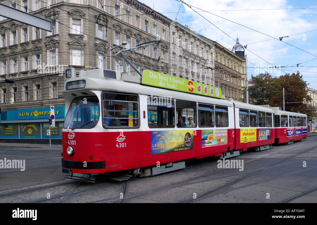 Red Line 18 tram car heading towards West Bahnhof in Vienna on Neubau ...