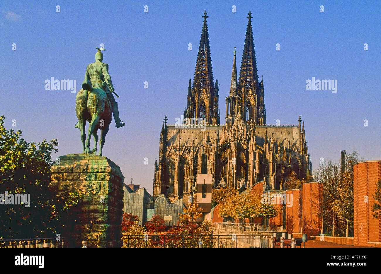 Cologne Cathedral with its twin spires and with a Kaiser statue in ...