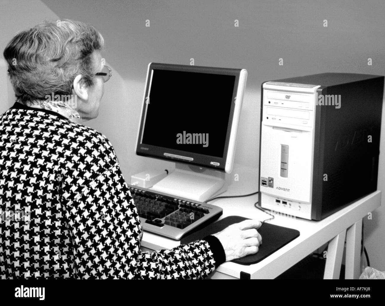 elderly woman getting to grips with a computer Stock Photo - Alamy