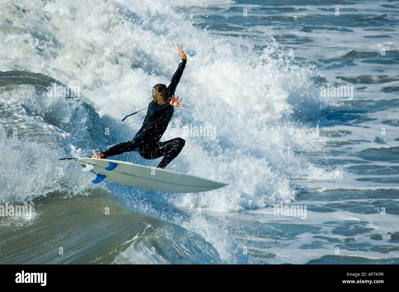 Surfer getting some air Stock Photo - Alamy