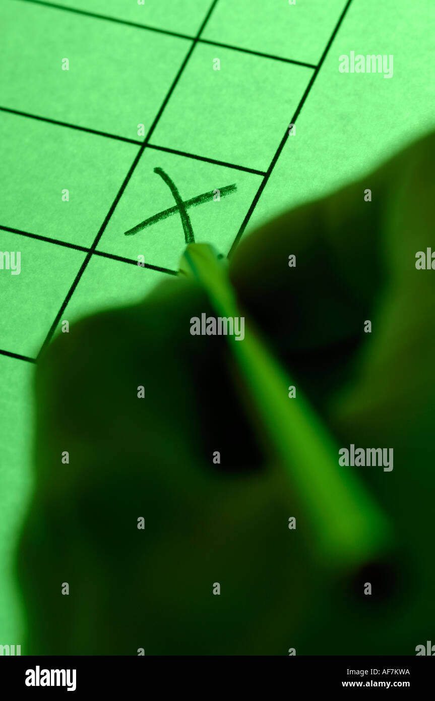 Pencil tip putting an x on a voting paper Stock Photo - Alamy