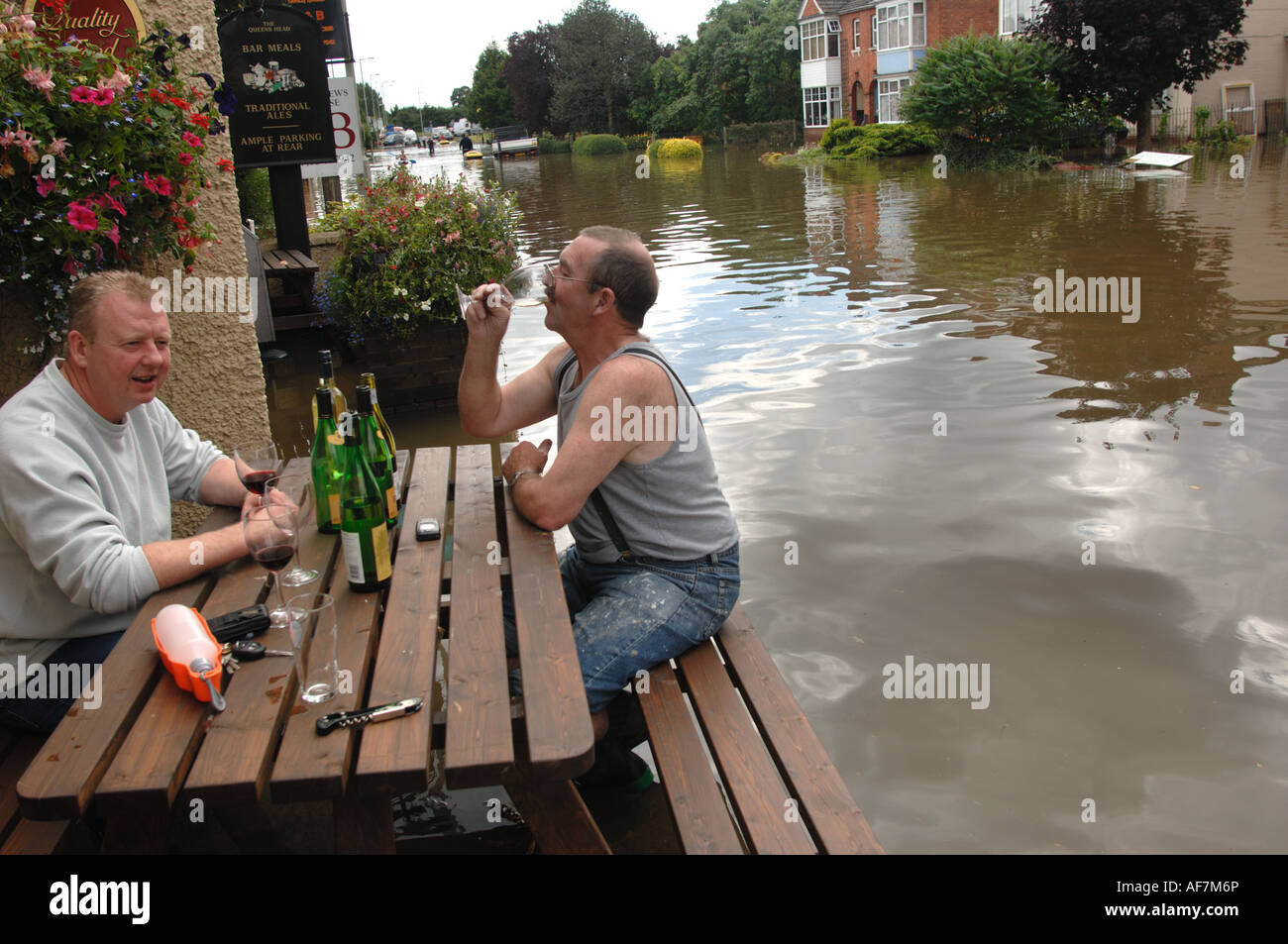 Landlord of the flooded Queens Head pub in Longford Gloucester England ...